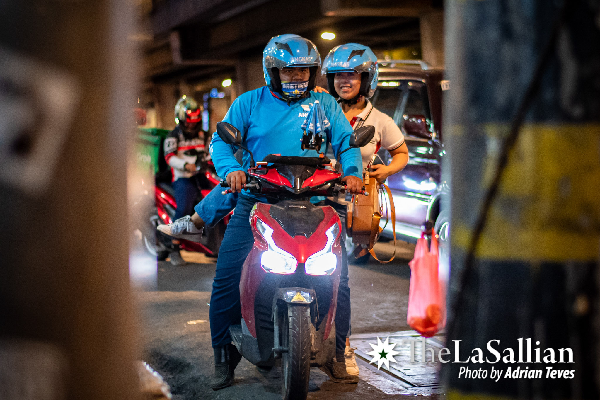 Motorcycle taxis squeeze through gaps in public transport – The LaSallian